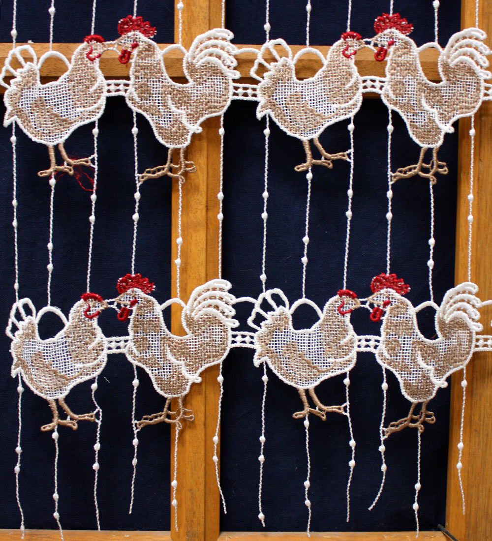 Macrame curtain in a country-themed color with hens and roosters